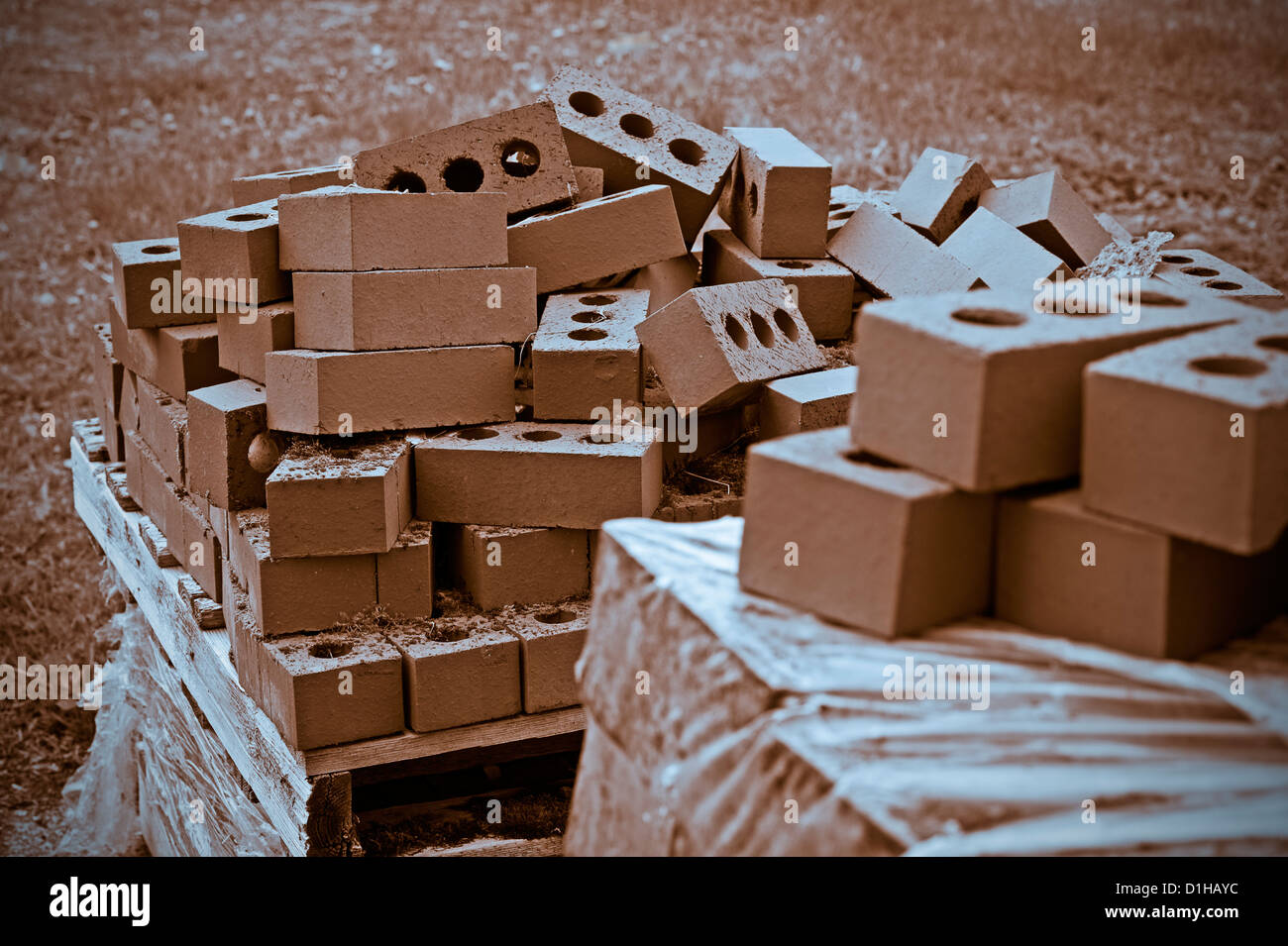 New bricks stacked on pallets outside old World War II US Navy base ...
