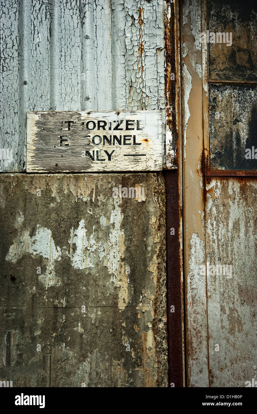 Warning sign outside old World War II US Navy base power house door in ...