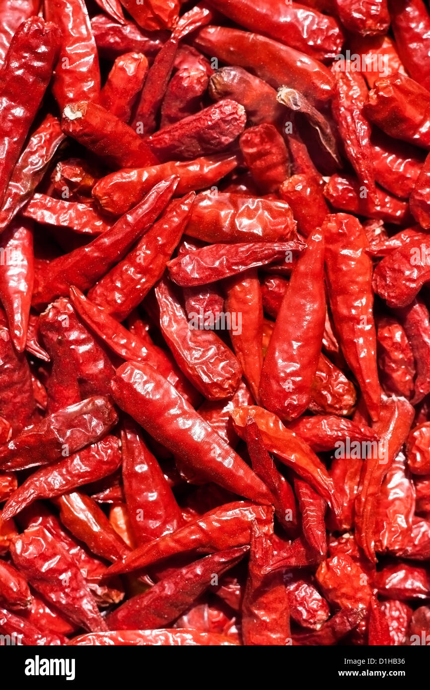 Red hot chili peppers drying on the sun background Stock Photo - Alamy