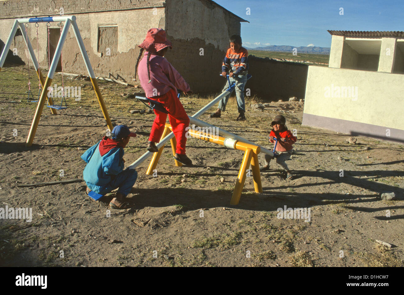 Native Aymara children playing in a village in the Altiplano region ...