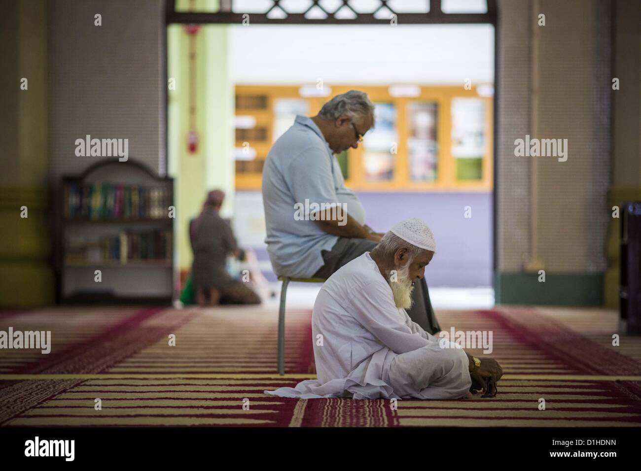 Dec. 22, 2012 - Singapore, Singapore - Men pray in the main prayer hall ...