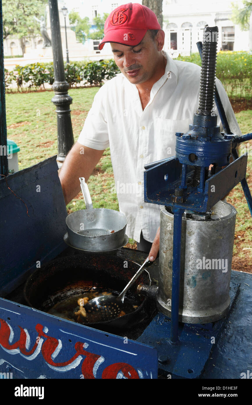 Churro churros food (Spanish donut) Cook (street vendor (selling) on ...