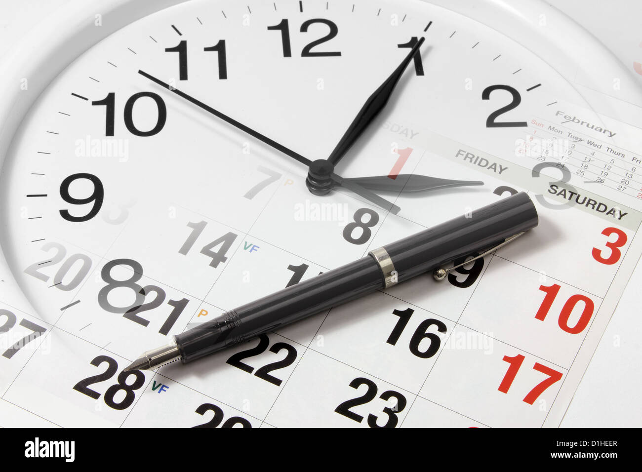 Pen on Calendar and Clock Stock Photo - Alamy