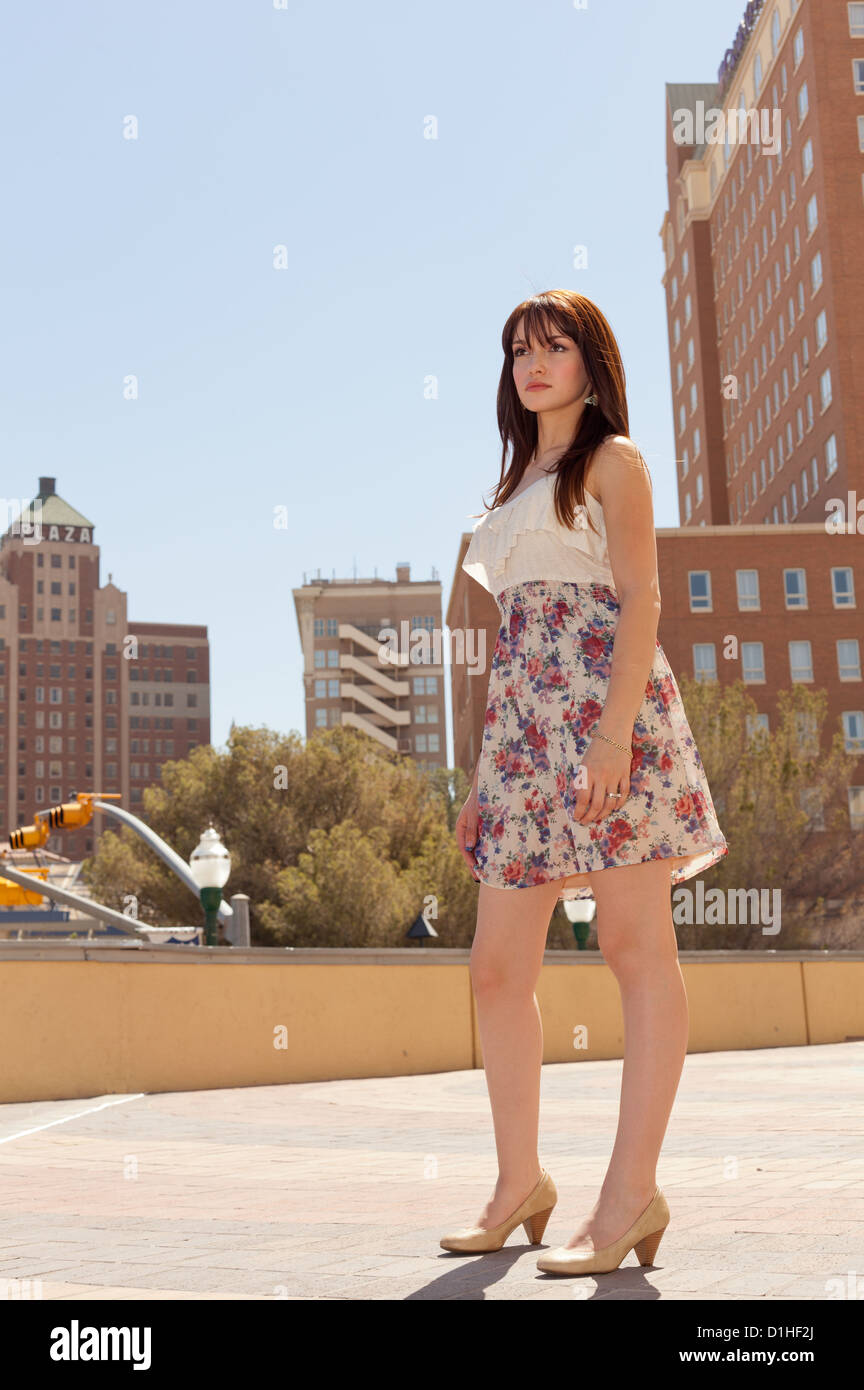 Pretty woman standing outside Stock Photo - Alamy