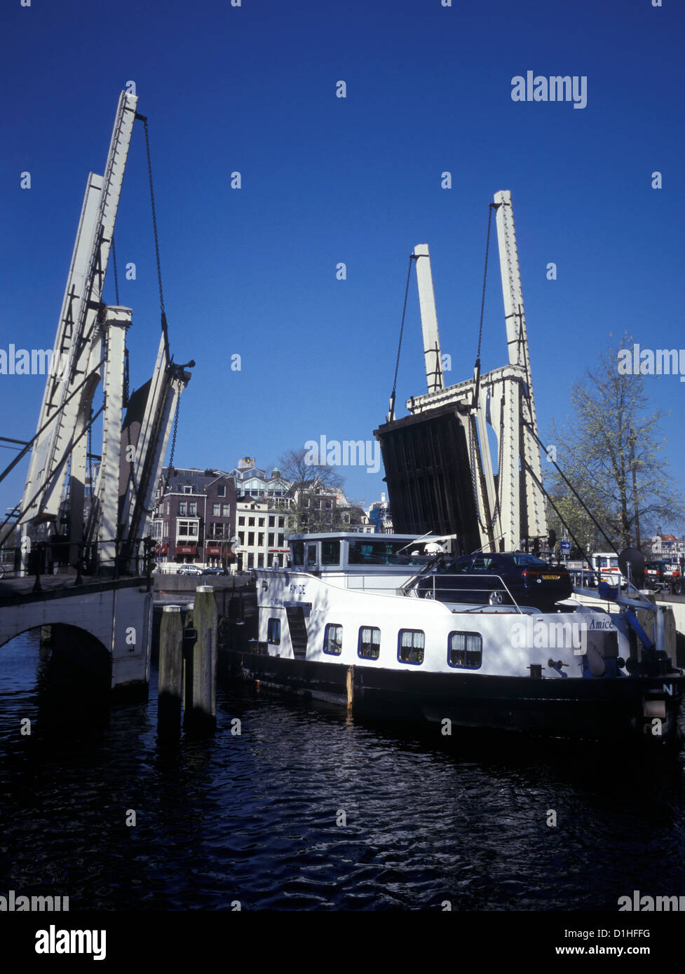 Netherlands, Amsterdam canal bridge, letting boat through, near Zwanen ...