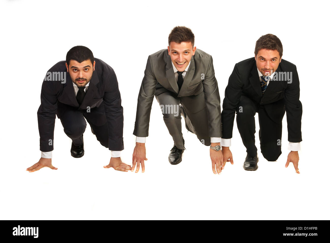 Three business men in a line being ready for start isolated on white ...