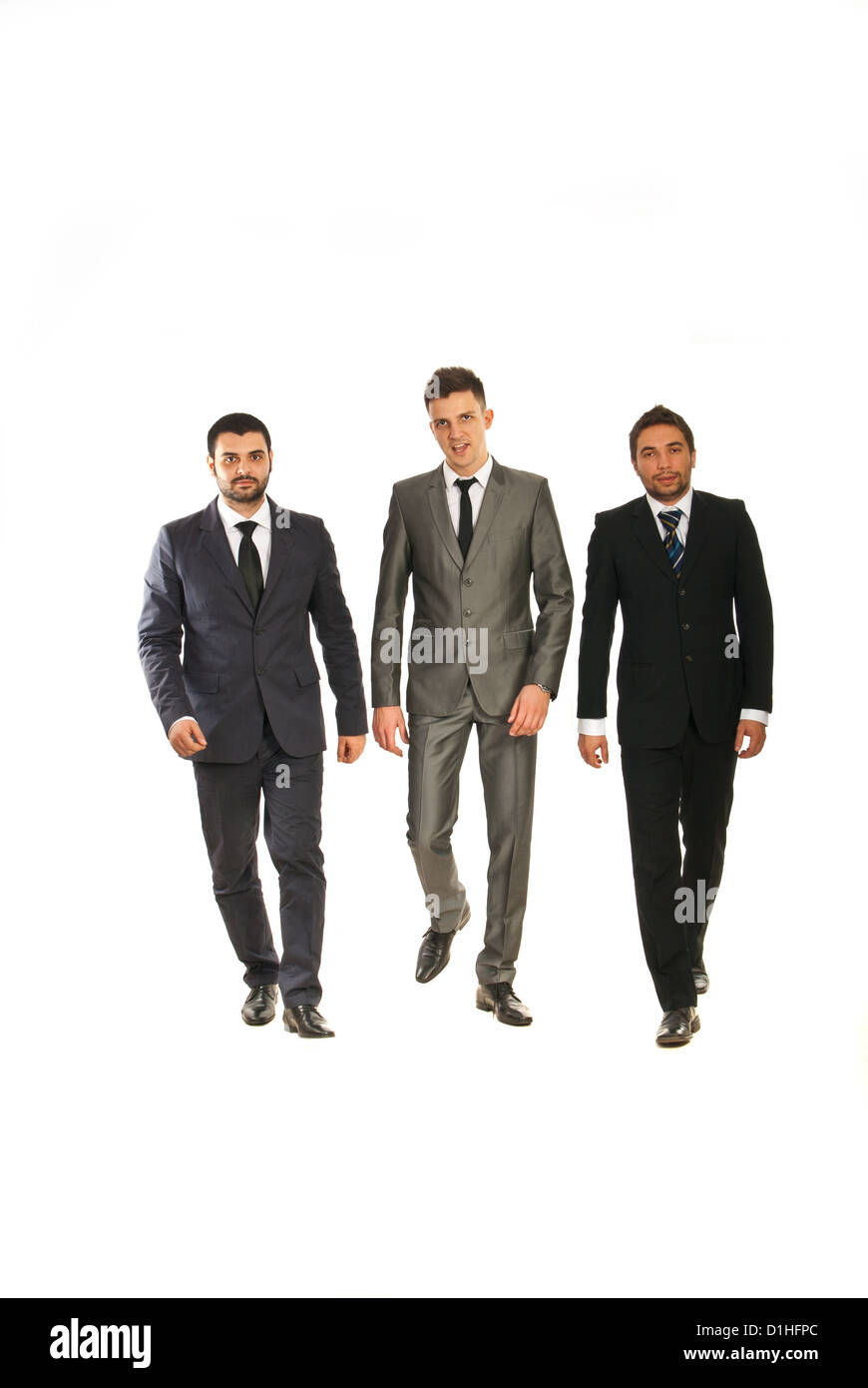 Three business men walking isolated on white background Stock Photo - Alamy