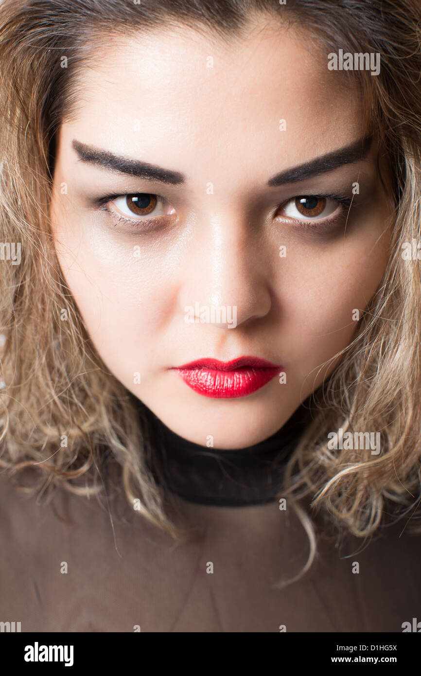 portrait of passionate aggressive woman on isolated white background ...
