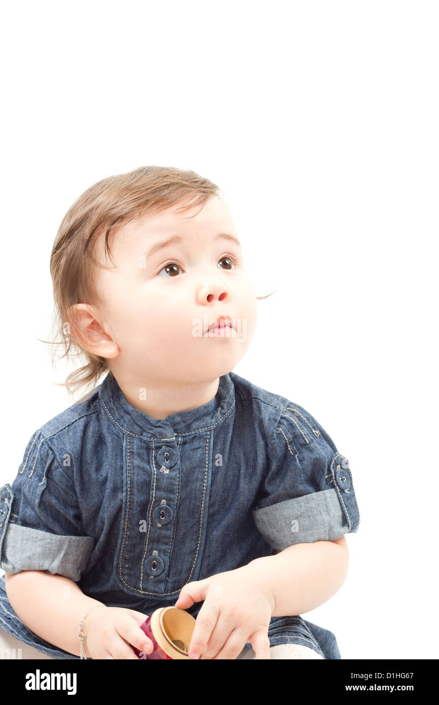 Adorable little baby girl with toy in the studio, isolated on white ...
