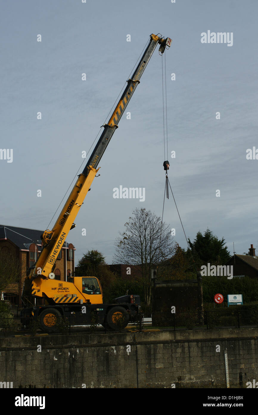A crane lifting a lock gate at Ware Lock in Hertfordshire Stock Photo ...