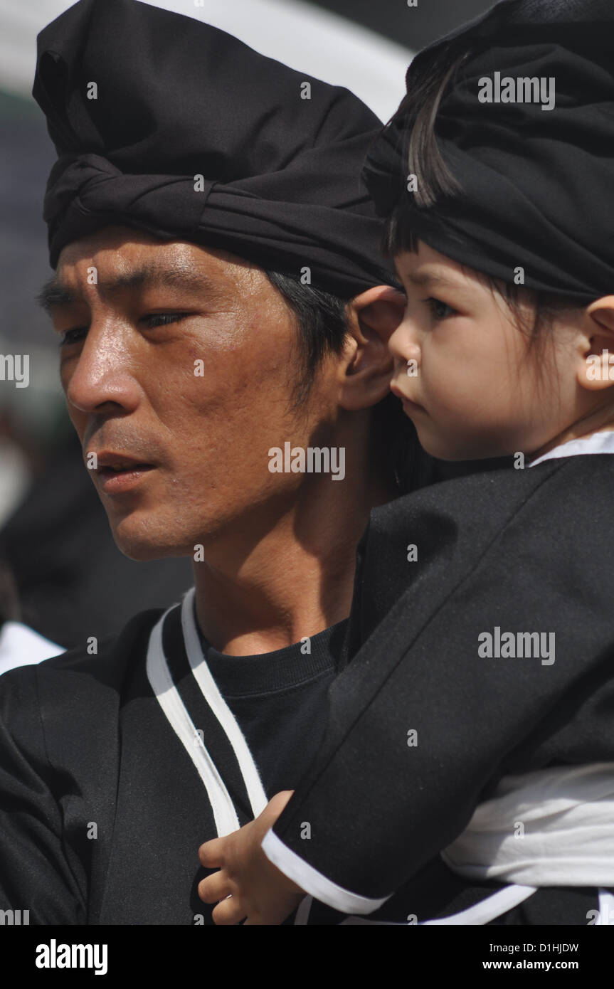 Naha, Okinawa, Japan, men in traditional Okinawan outfit along Kokusai ...