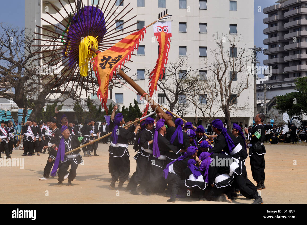 Naha, Okinawa, Japan, men in traditional Okinawan outfit carrying Eisa ...