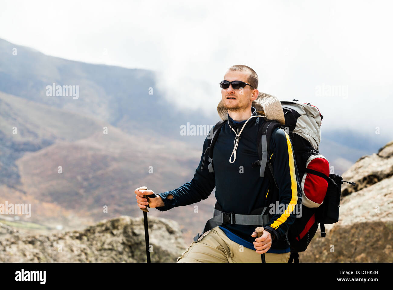 Man on hiking trip in Himalaya Mountains Stock Photo - Alamy