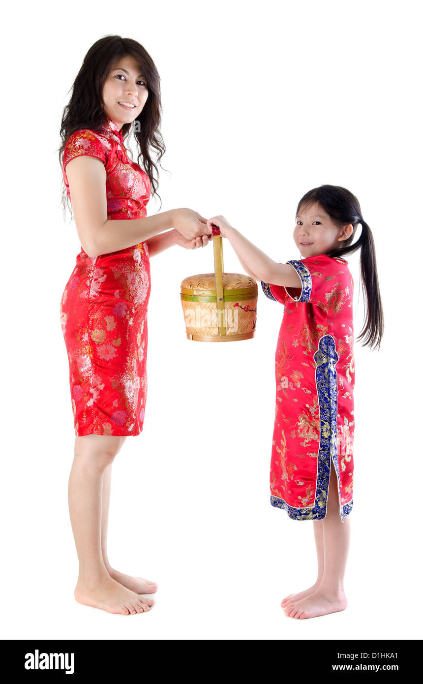 Full body oriental family in chinese red cheongsam dress, celebrating ...