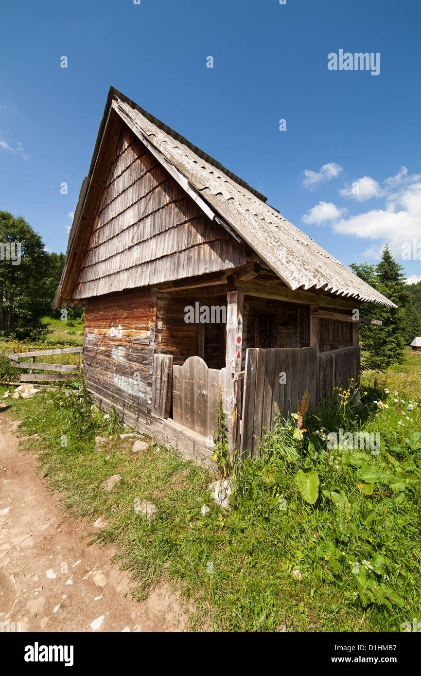 Traditional Romanian wooden hut near the forest Stock Photo - Alamy