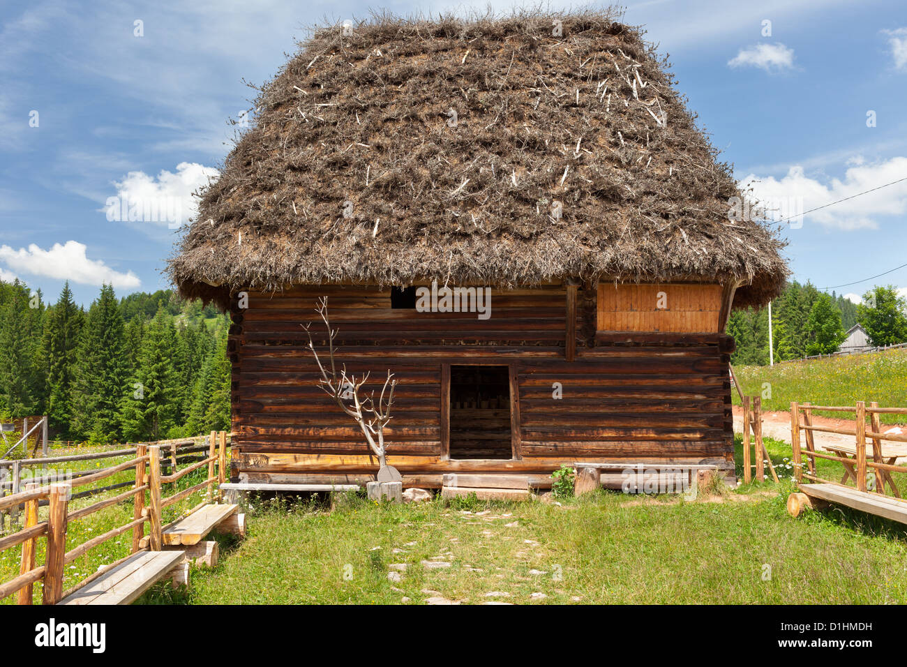 Traditional Romanian wooden hut near the forest Stock Photo - Alamy
