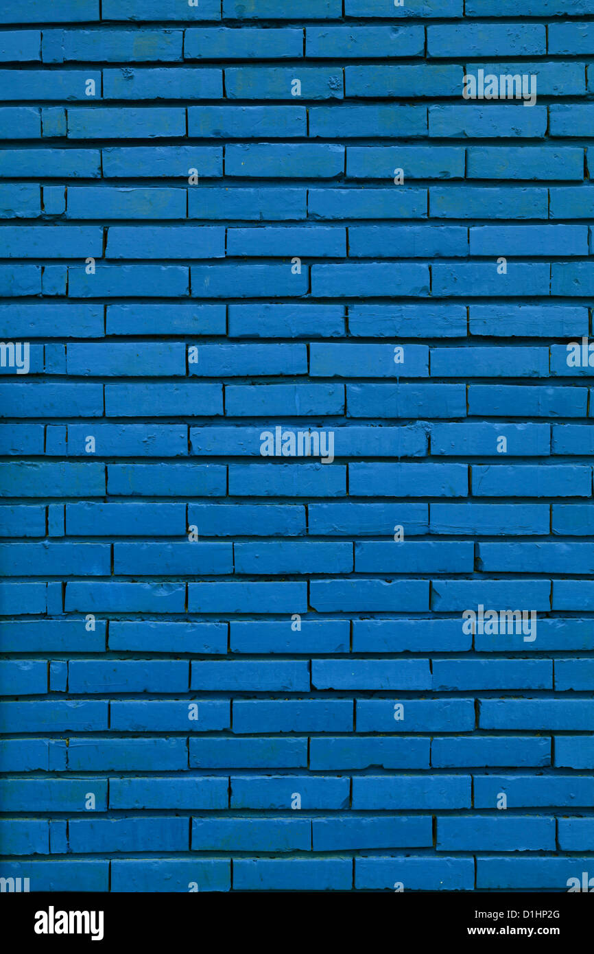 front brick wall painted blue Stock Photo - Alamy
