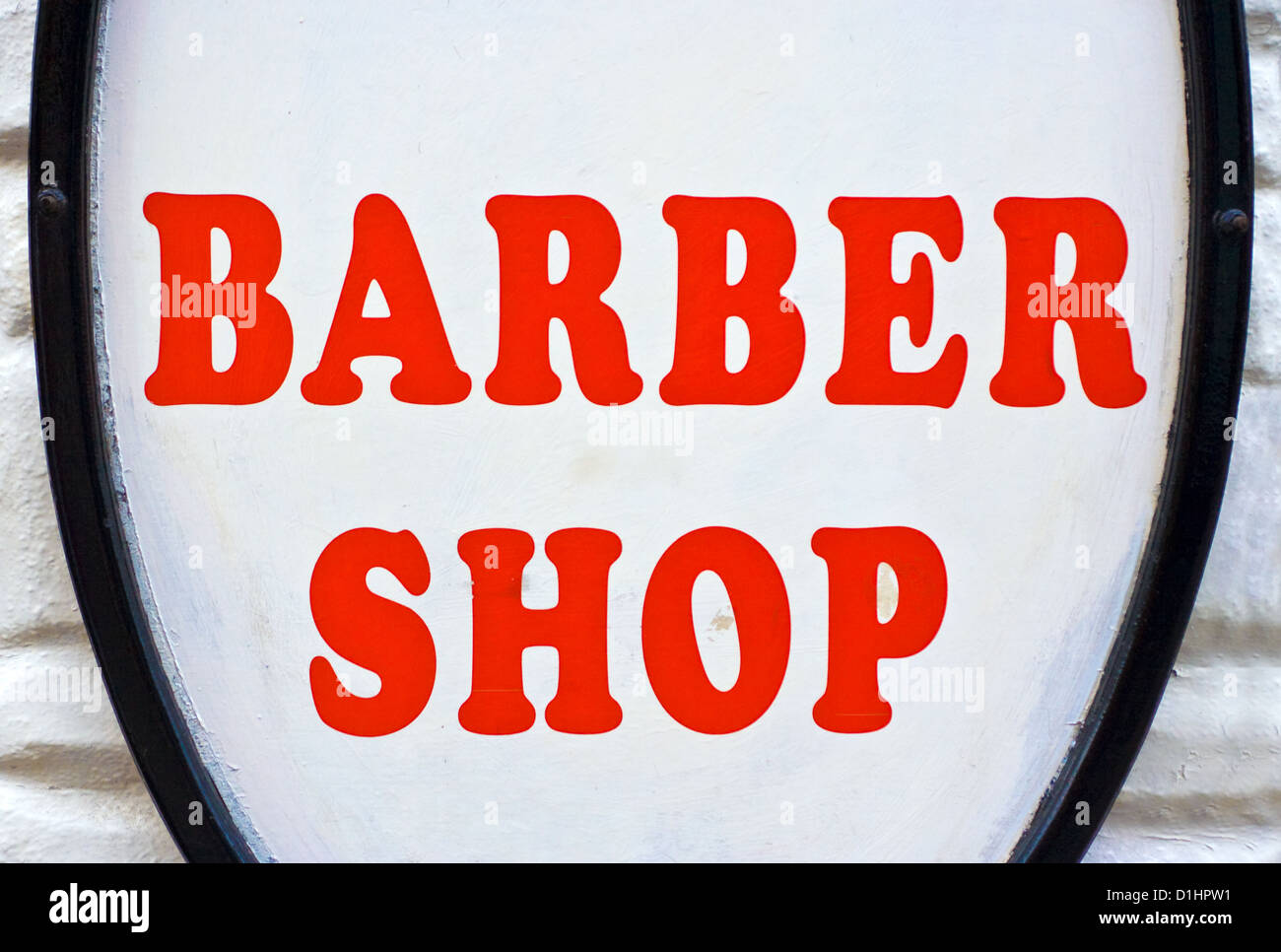A Barber Shop sign with red letters and a white background Stock Photo ...