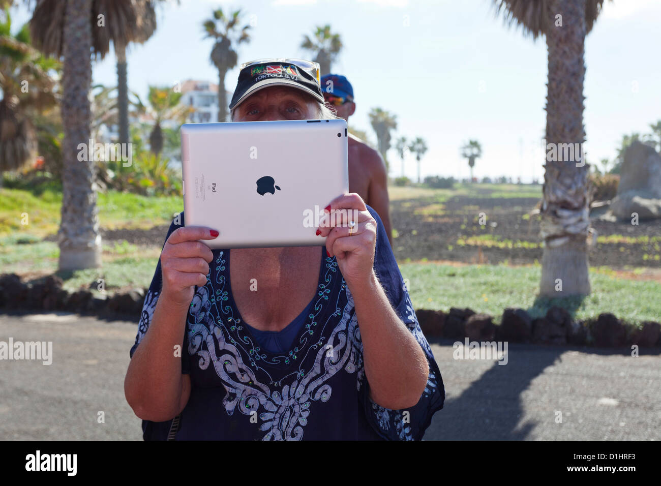 Lady filming with iPad Stock Photo - Alamy