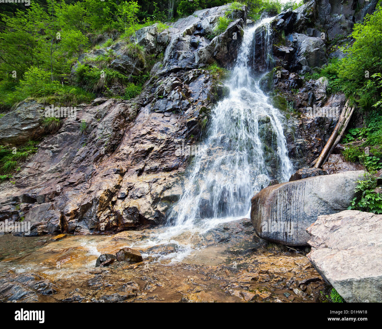 Landscape with a waterfall in a summer day Stock Photo - Alamy