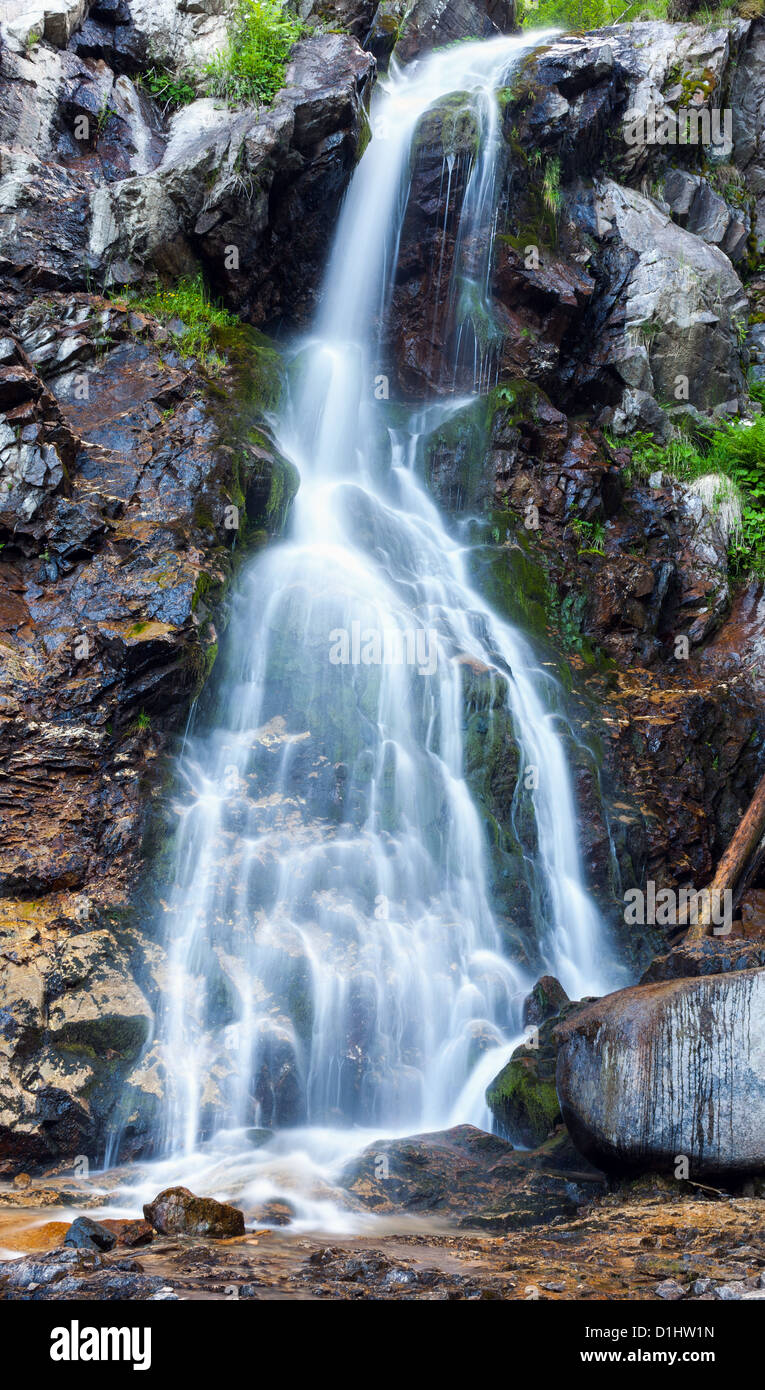 Landscape with a waterfall in a summer day Stock Photo - Alamy