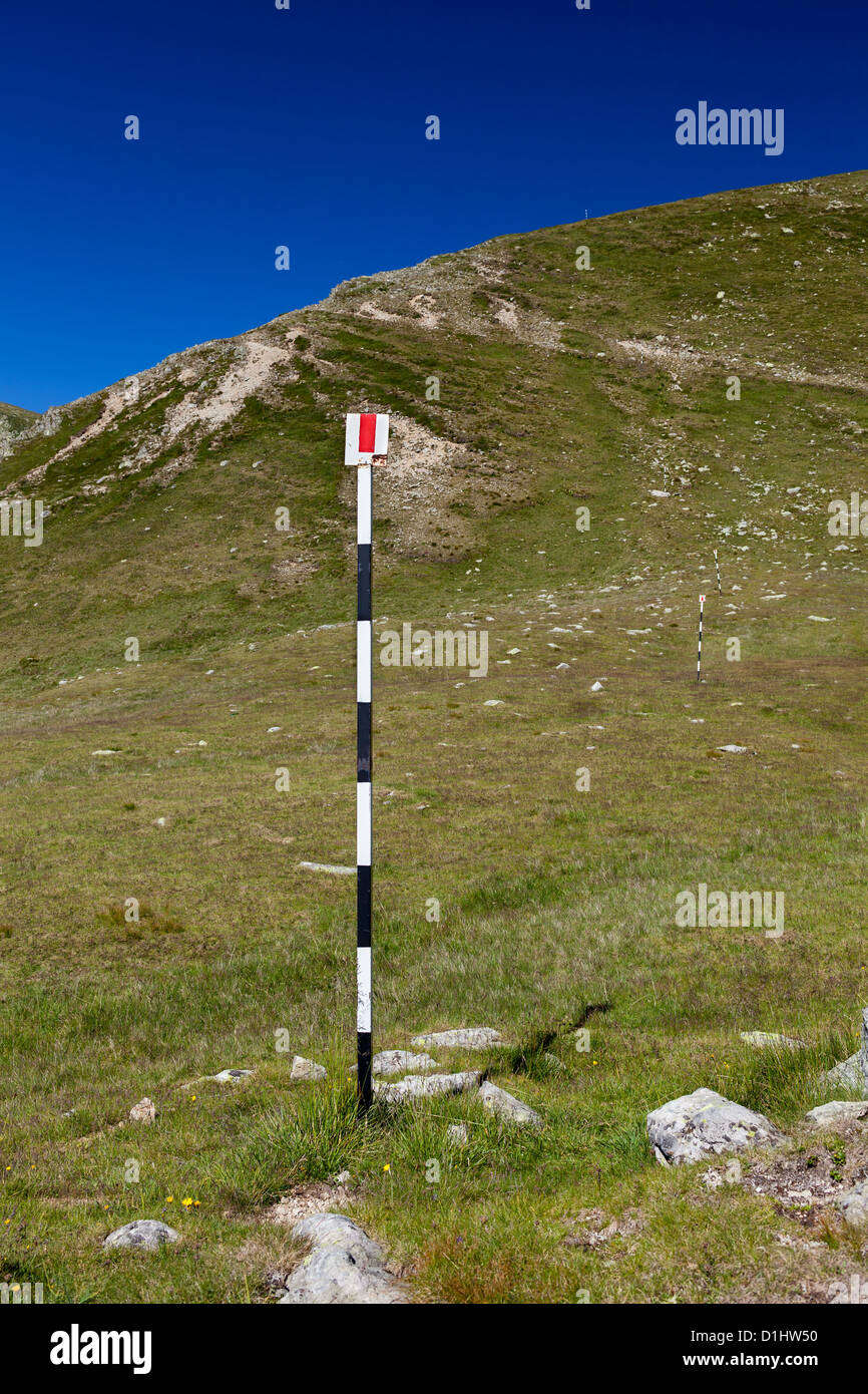 Mountain landscape with hiking trail and route signs Stock Photo - Alamy