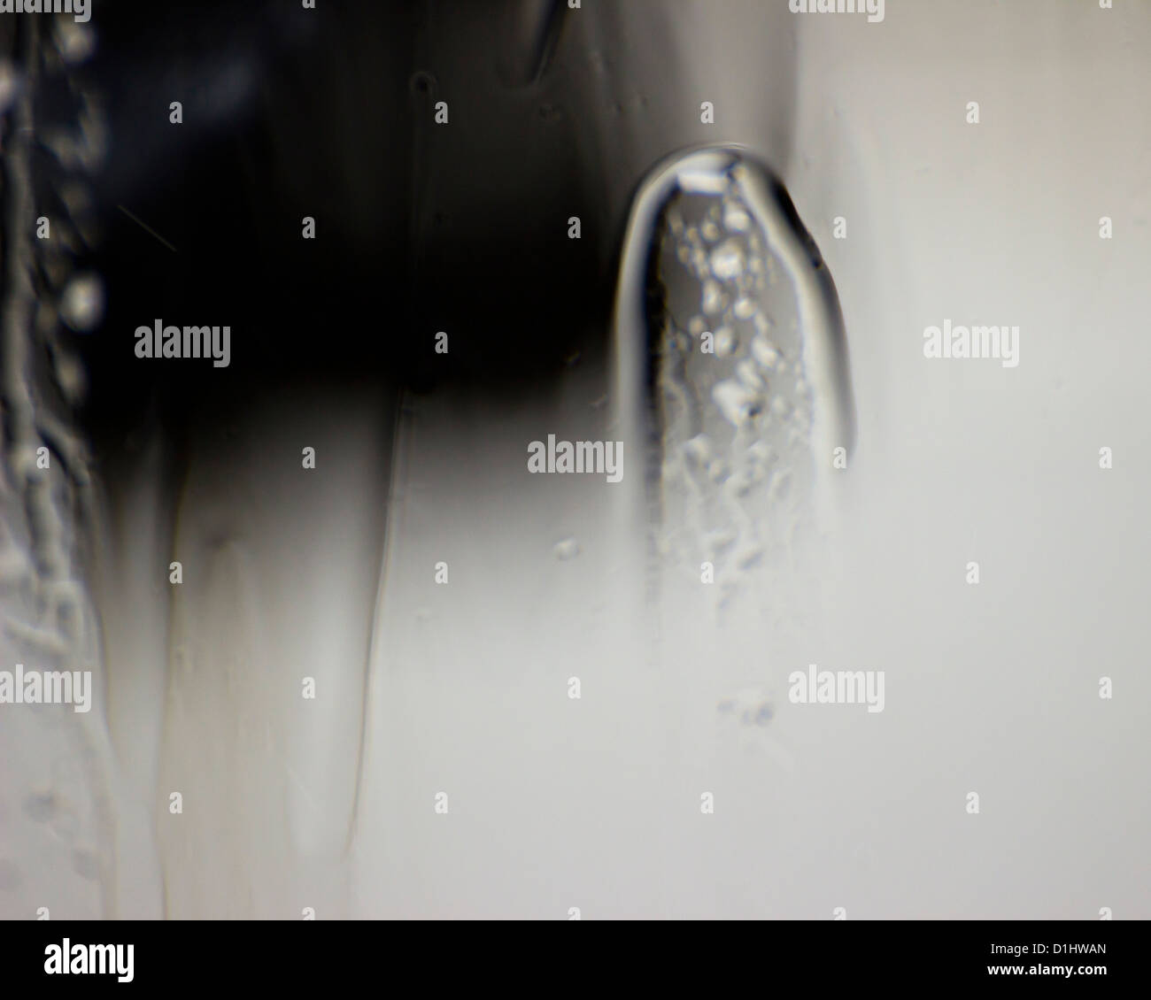 Drip loop - pattern formed by water drops on a cafe window Stock Photo ...