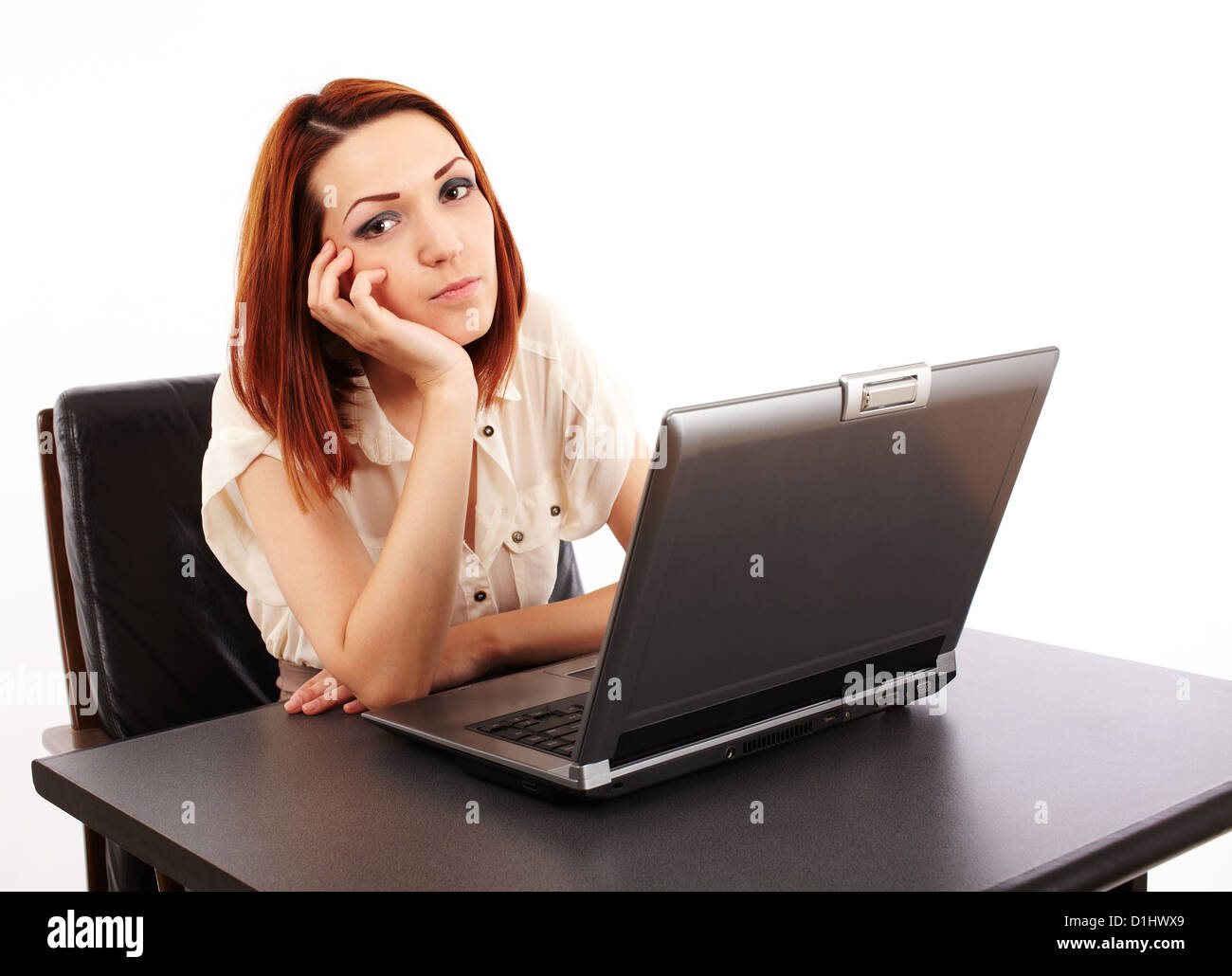 Bored young woman at her computer on white background Stock Photo - Alamy