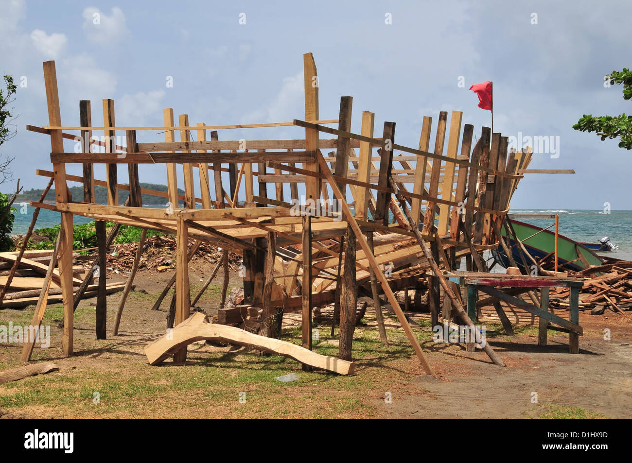 Blue sky white clouds view cedar wood boat being built on stocks ...