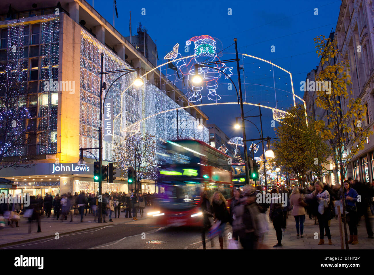 mas lights in early evening busy with shoppers and traffic London ...