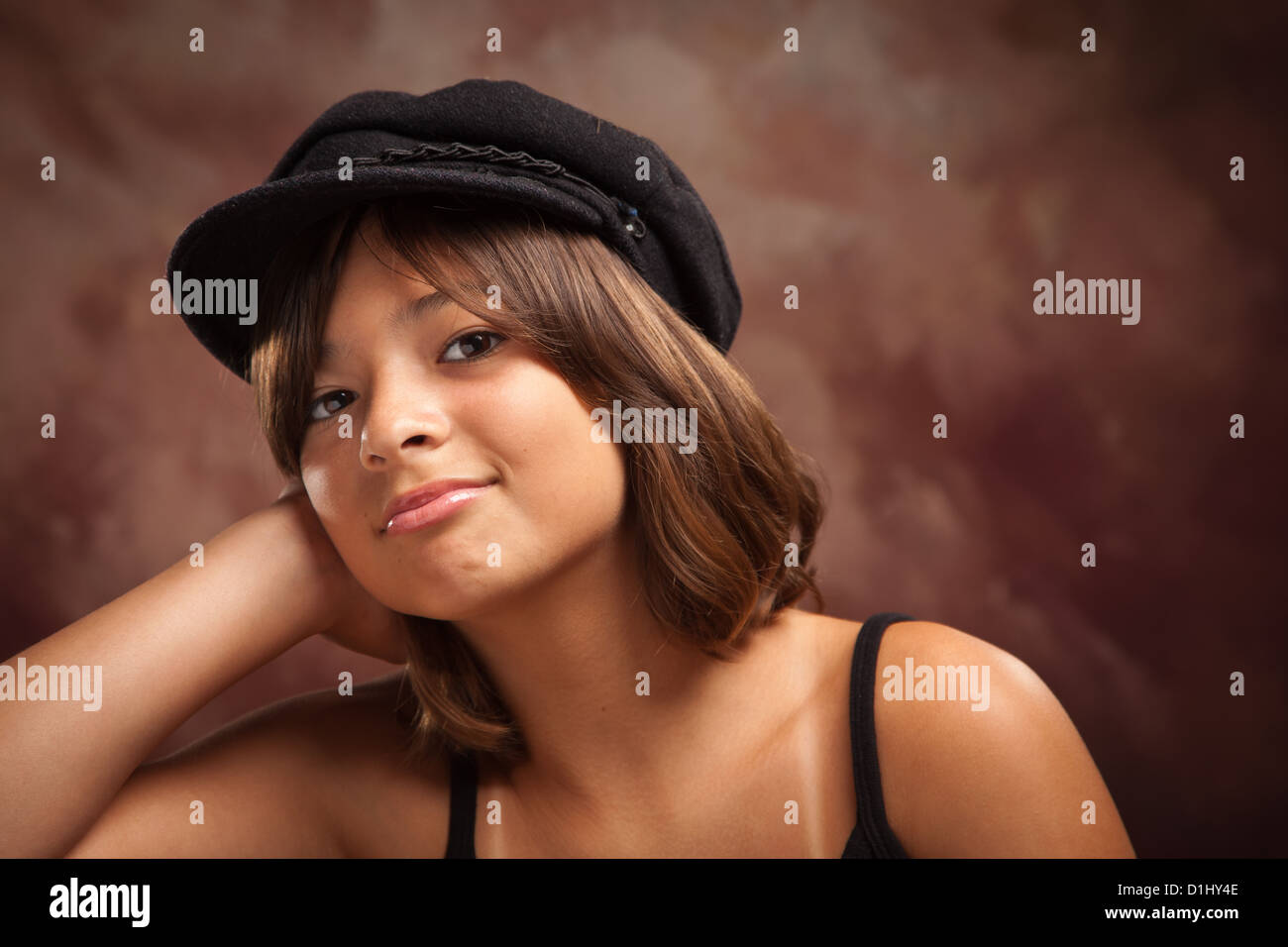 Pretty Hispanic Girl with Hat Studio Portrait Stock Photo - Alamy