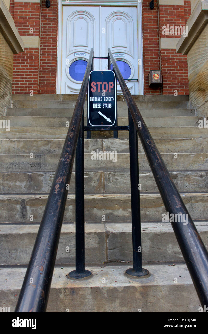 Staircase and railings with amusing sign Stock Photo - Alamy