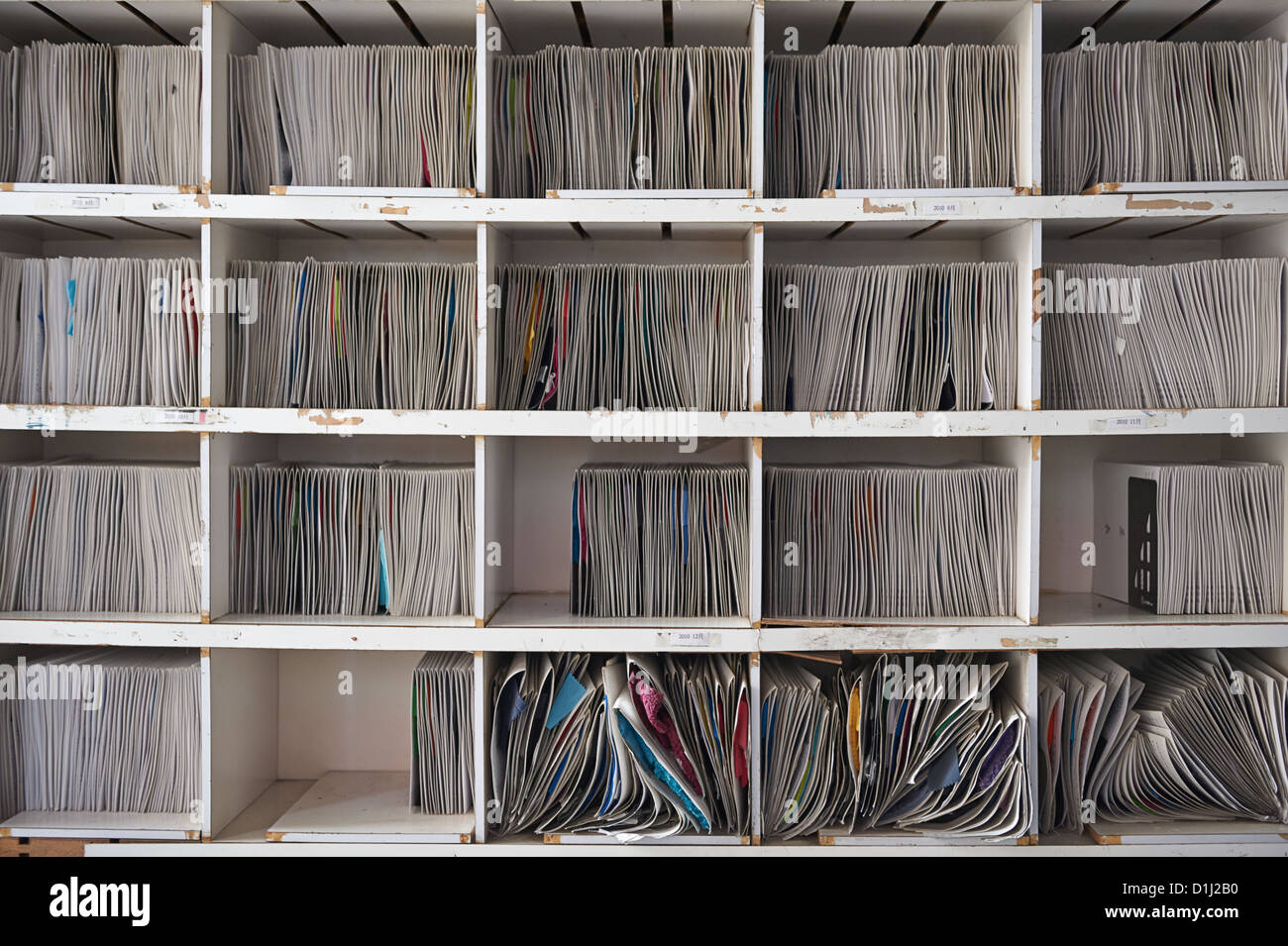 Fabric samples organized in shelves Stock Photo - Alamy