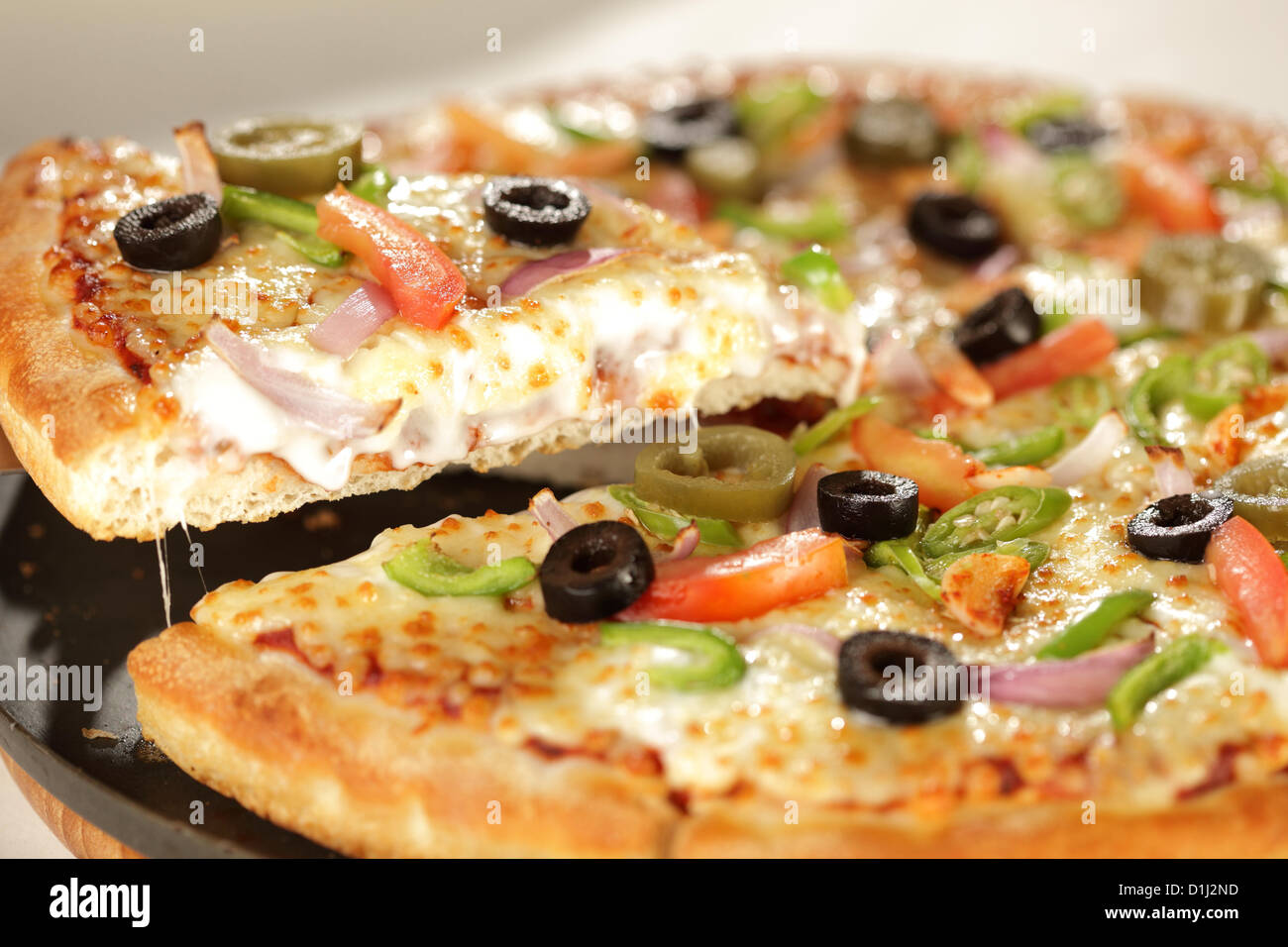 Delicious Vegetable cheese pizza Stock Photo - Alamy