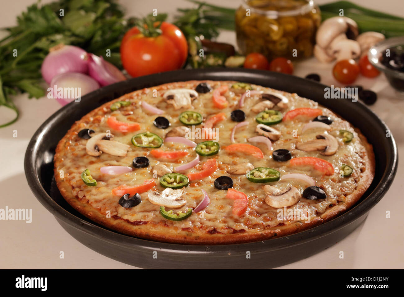 Delicious Vegetable cheese pizza Stock Photo - Alamy