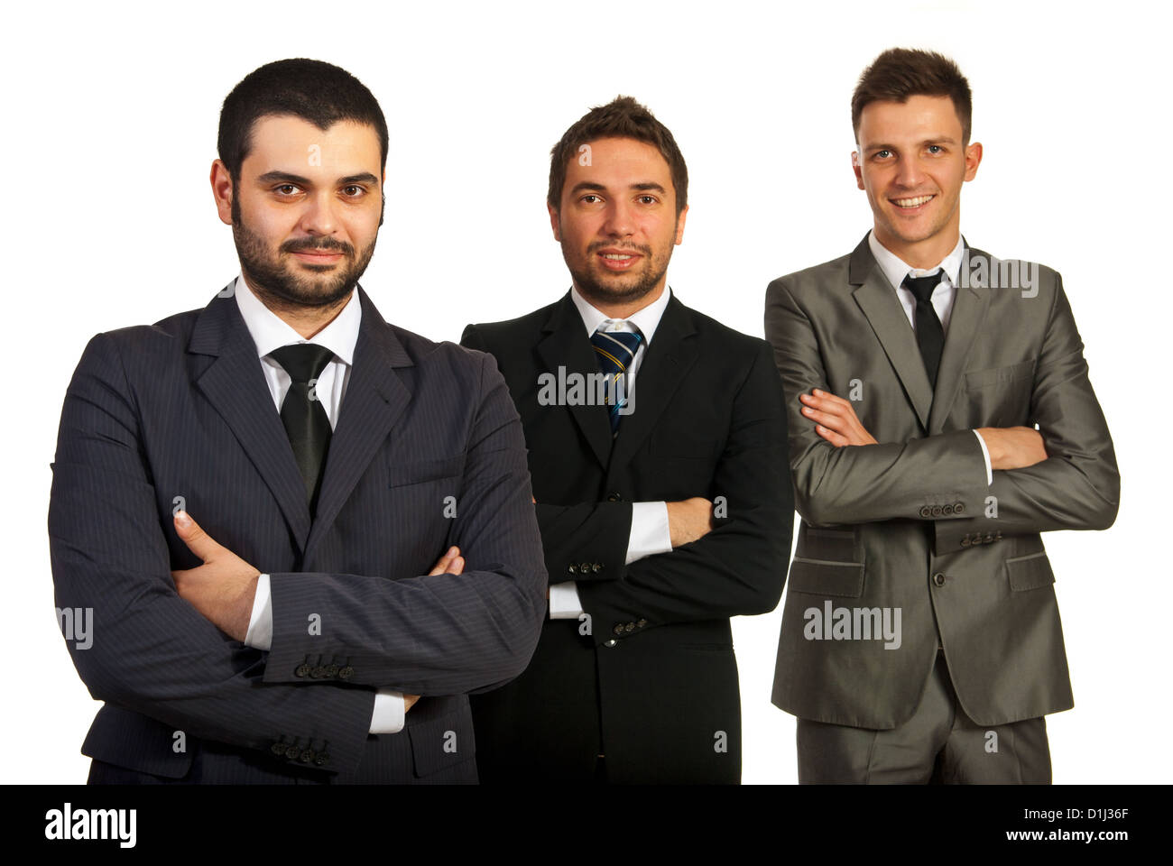 Cheerful group of three business men standing with arms folded in a ...