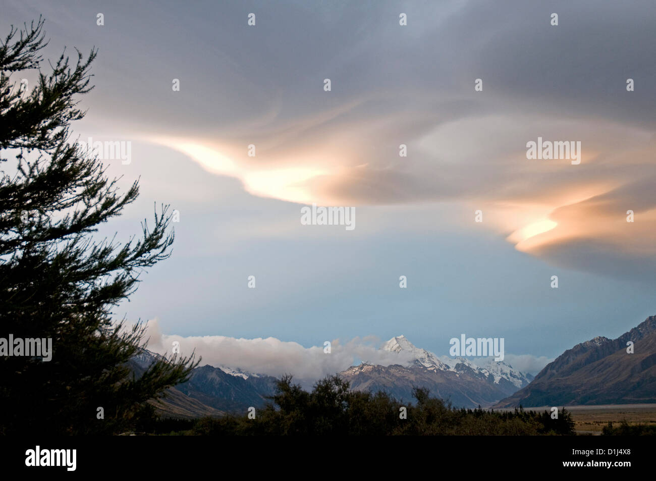 Striking sunset featuring Mt Cook. Altocumulus lenticular cloud is ...