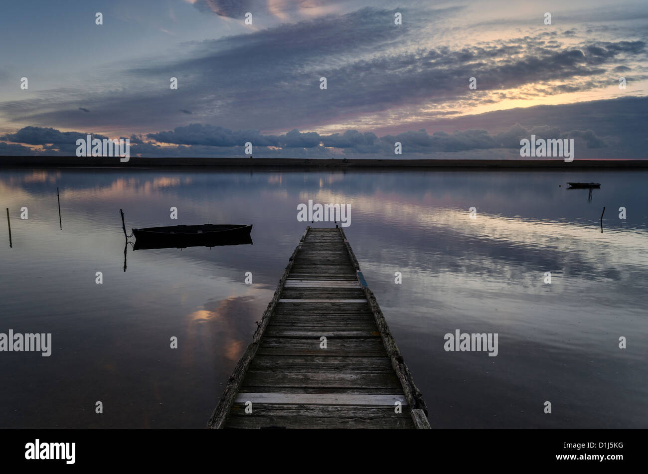 The sun sets over the Fleet lagoon at Chesil Beach near Weymouth on ...