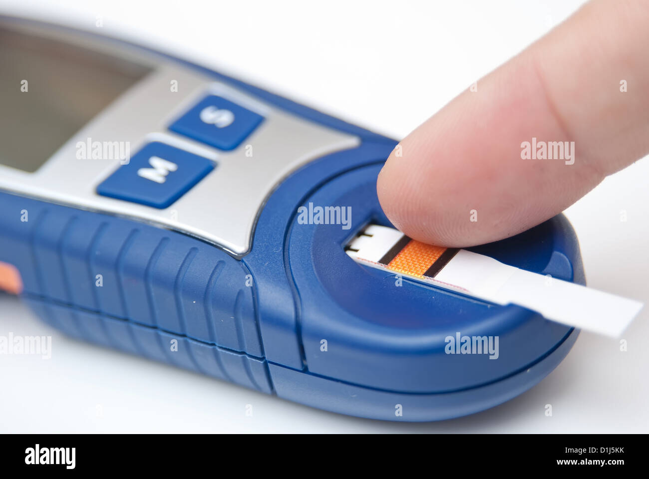 Blood glucose self testing Stock Photo - Alamy