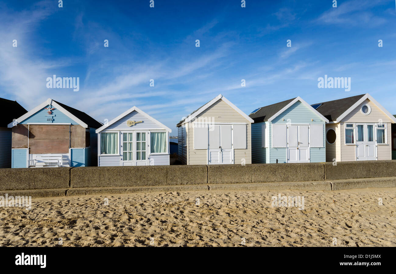 Row of brightly coloured beach huts at Hengistbury Head near ...