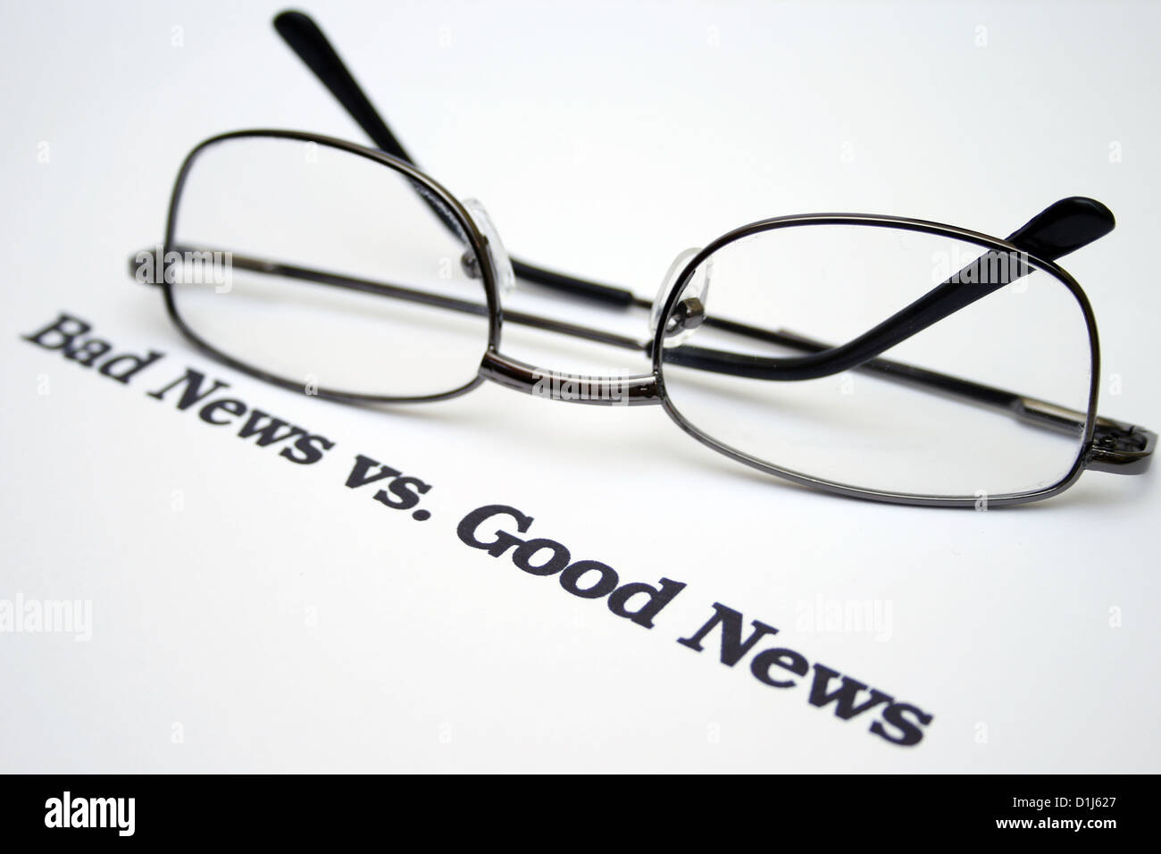 Bad news vs. good news text Stock Photo - Alamy