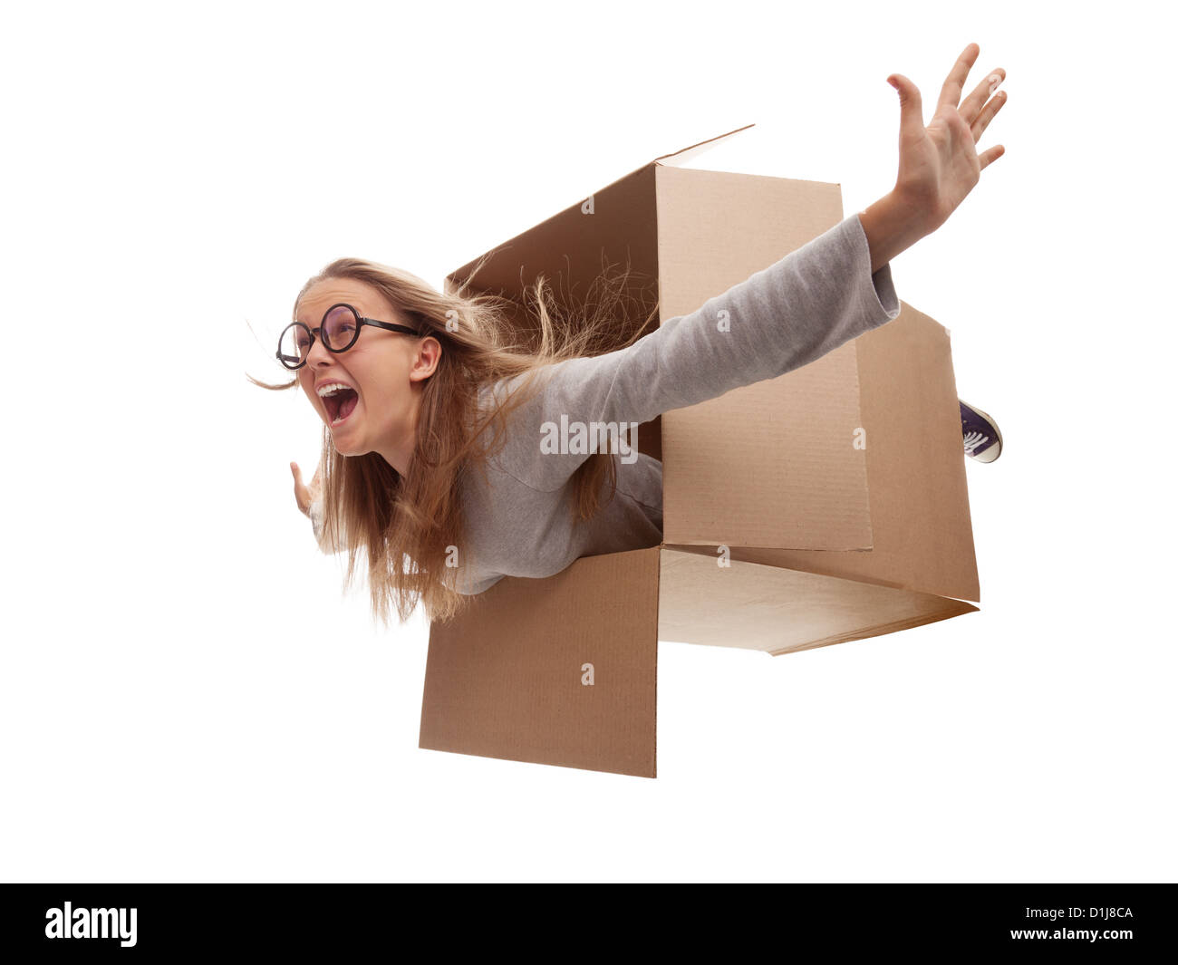 The girl in a cardboard box flies in white background Stock Photo - Alamy