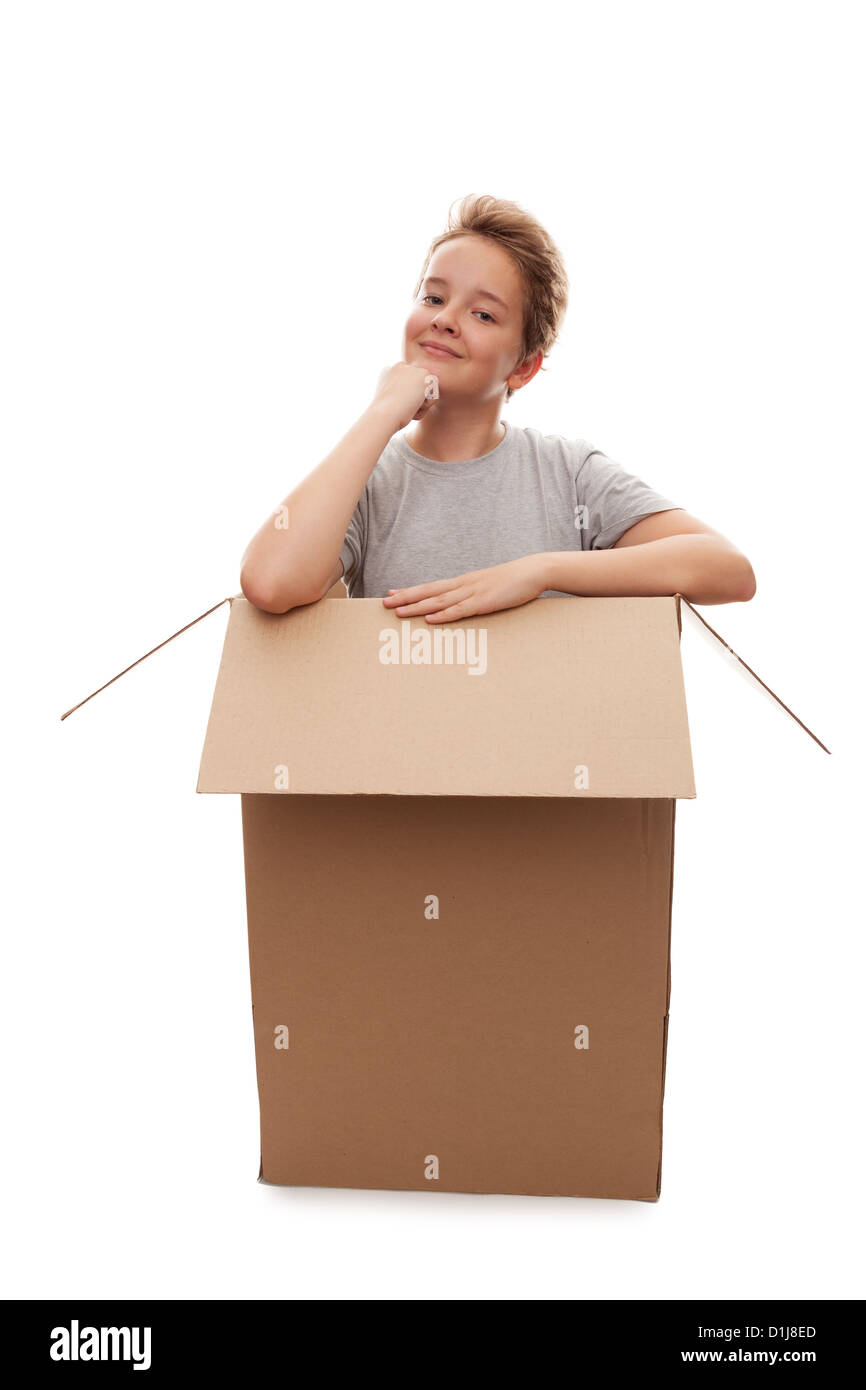 boy in a cardboard box on a white background Stock Photo - Alamy