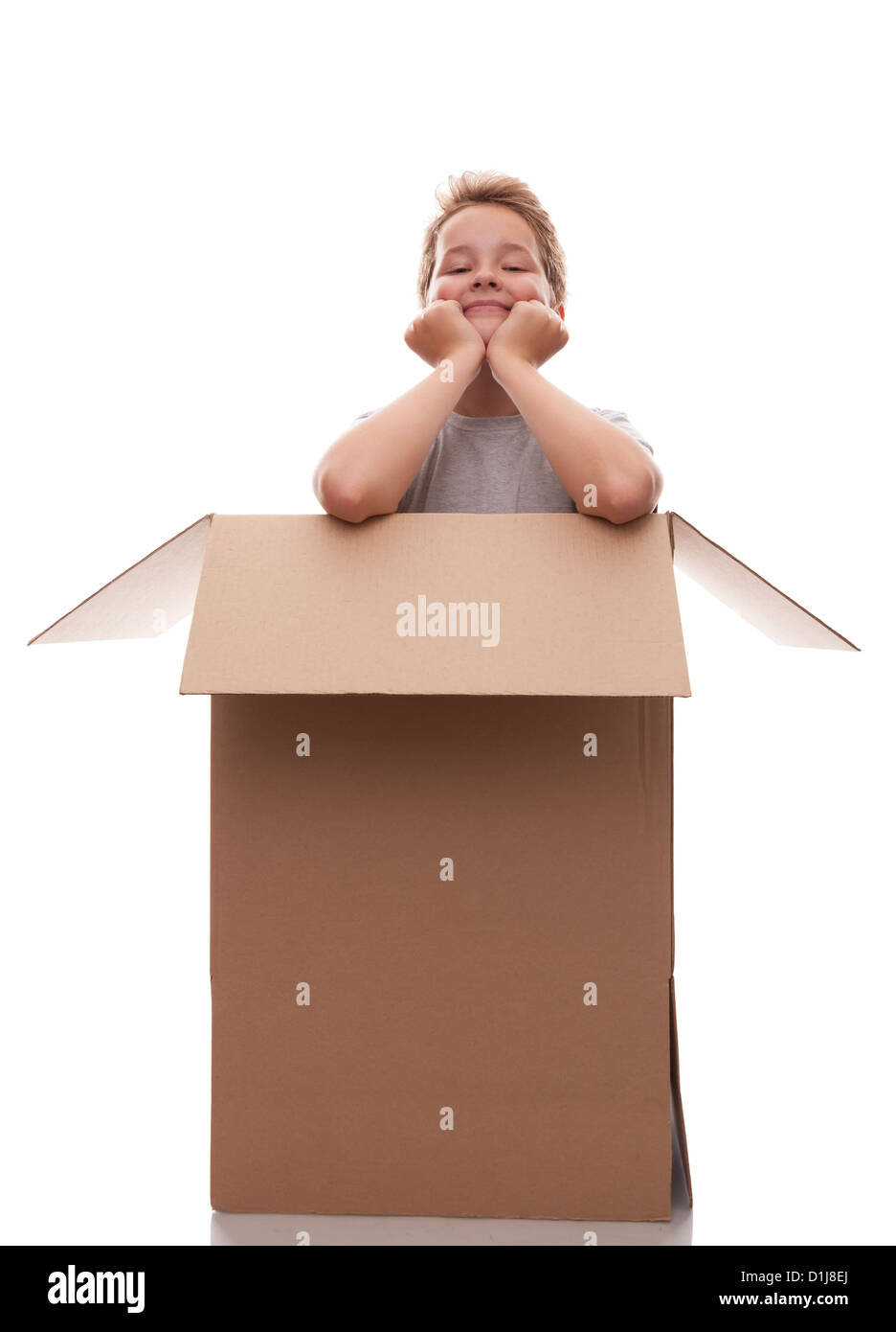 boy in a cardboard box on a white background Stock Photo - Alamy