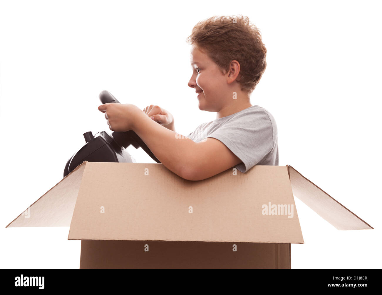 boy-driver of a cardboard box, isolated on white Stock Photo - Alamy