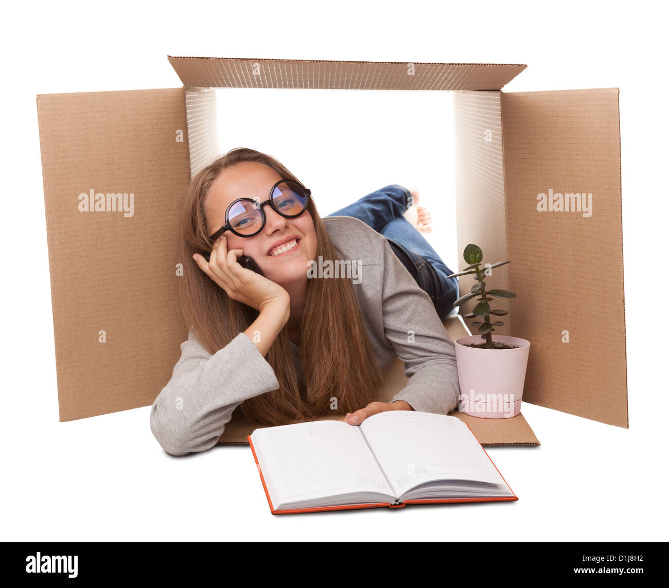girl has retired to a cardboard box Stock Photo - Alamy