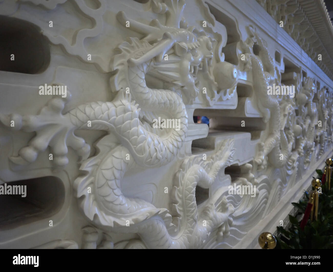 nine dragon wall craving inside bejing airport Stock Photo - Alamy