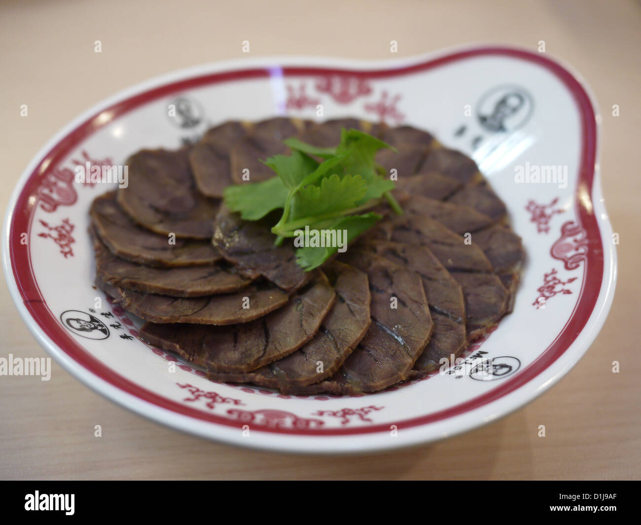 thinly sliced beef with soya source chinese dish Stock Photo - Alamy