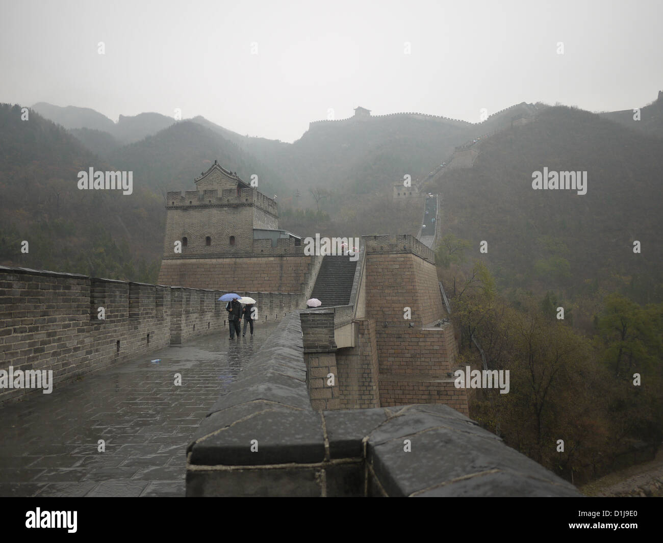great wall raining people umbrella Stock Photo - Alamy