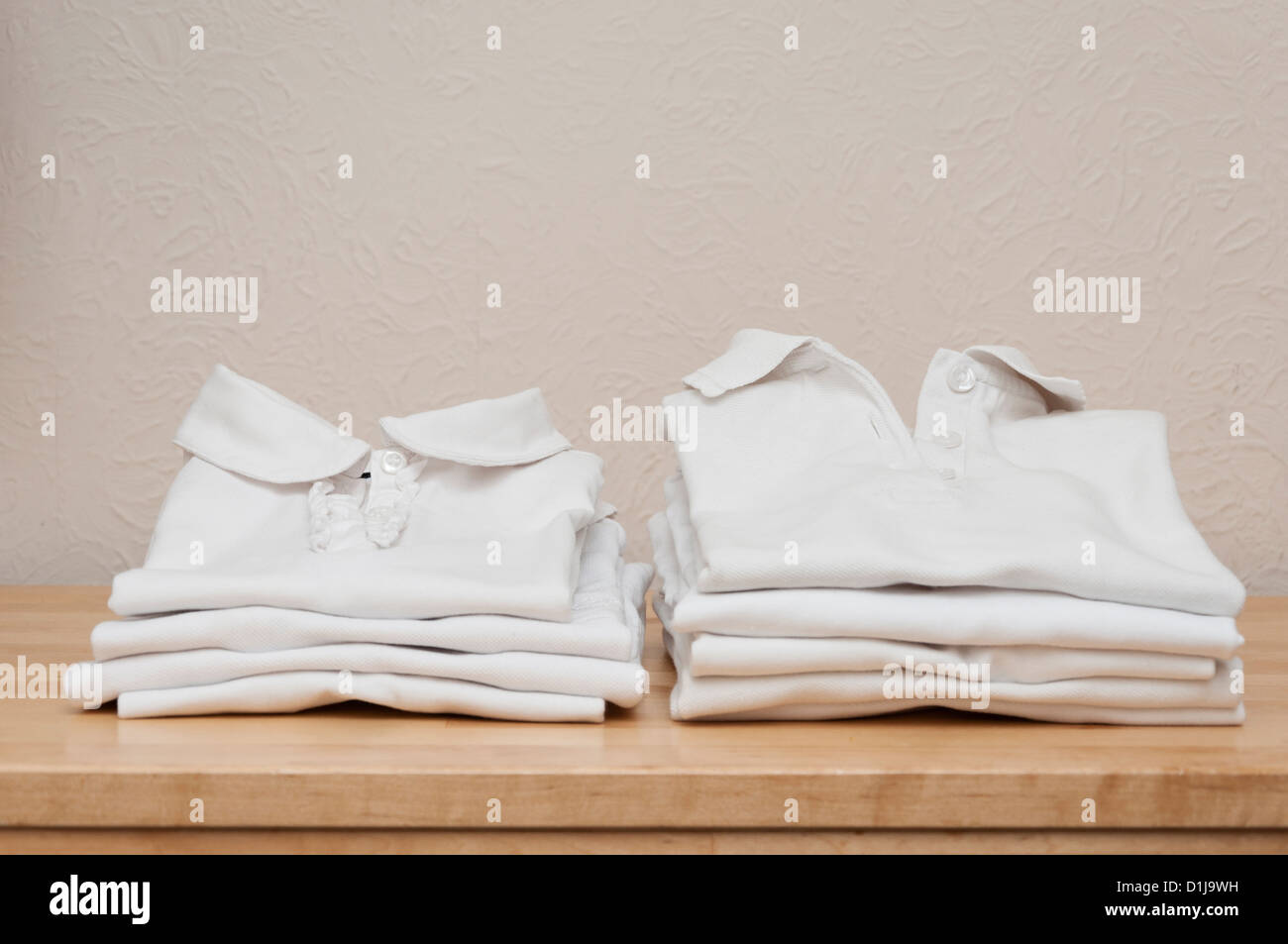 Folded shirts pile hi-res stock photography and images - Alamy